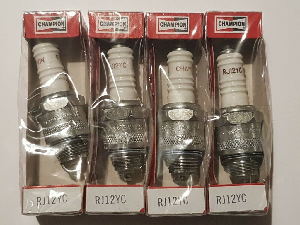Set of four new Champion RJ12YC (stock - 14) Spark Plugs - ABC Spares